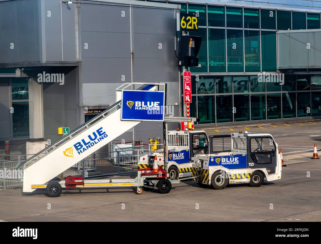 View through plane window Blue Handling aviation vehicles at London ...