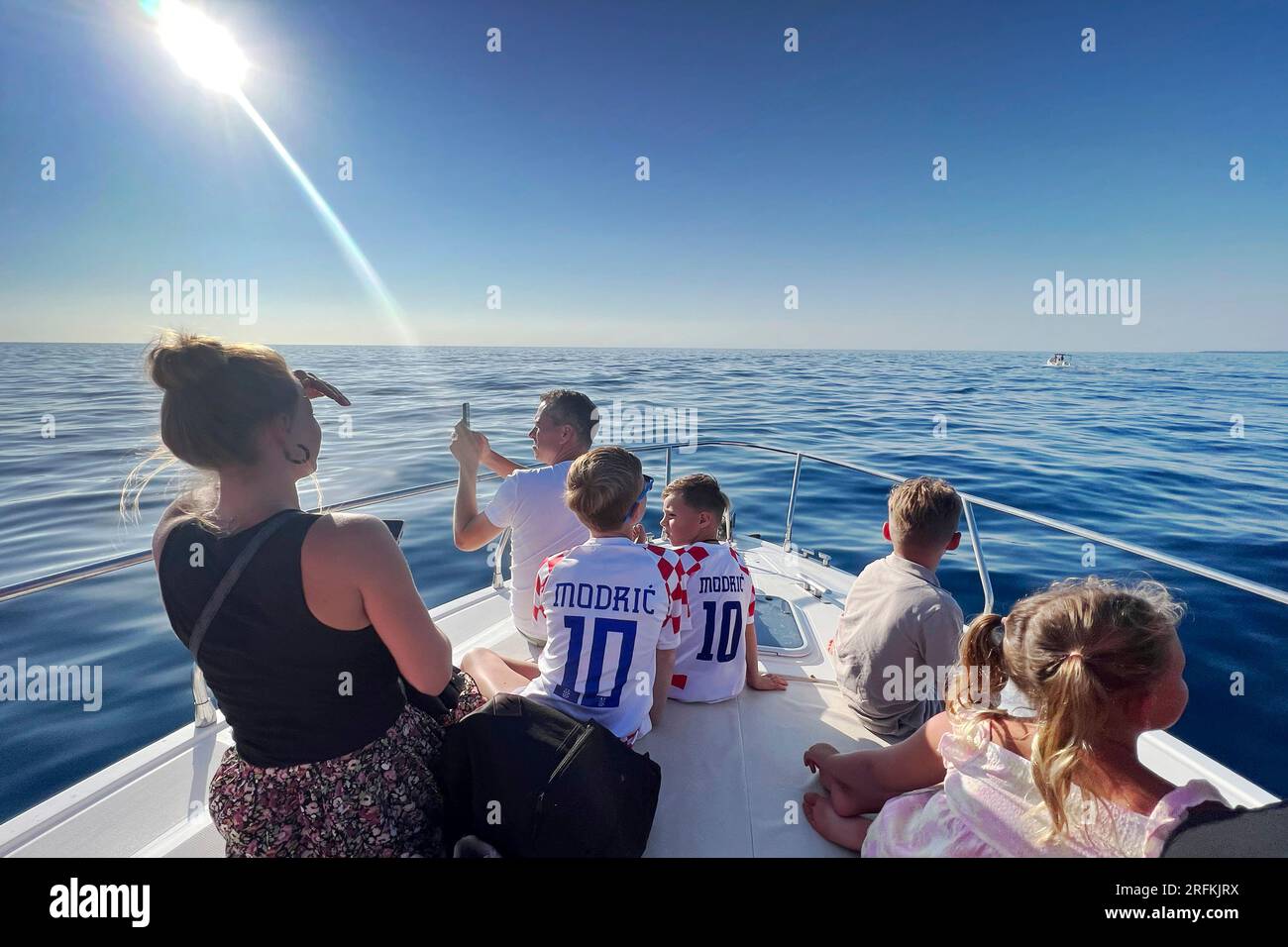People, family on the deck of a motor yacht during a boat tour in the ...