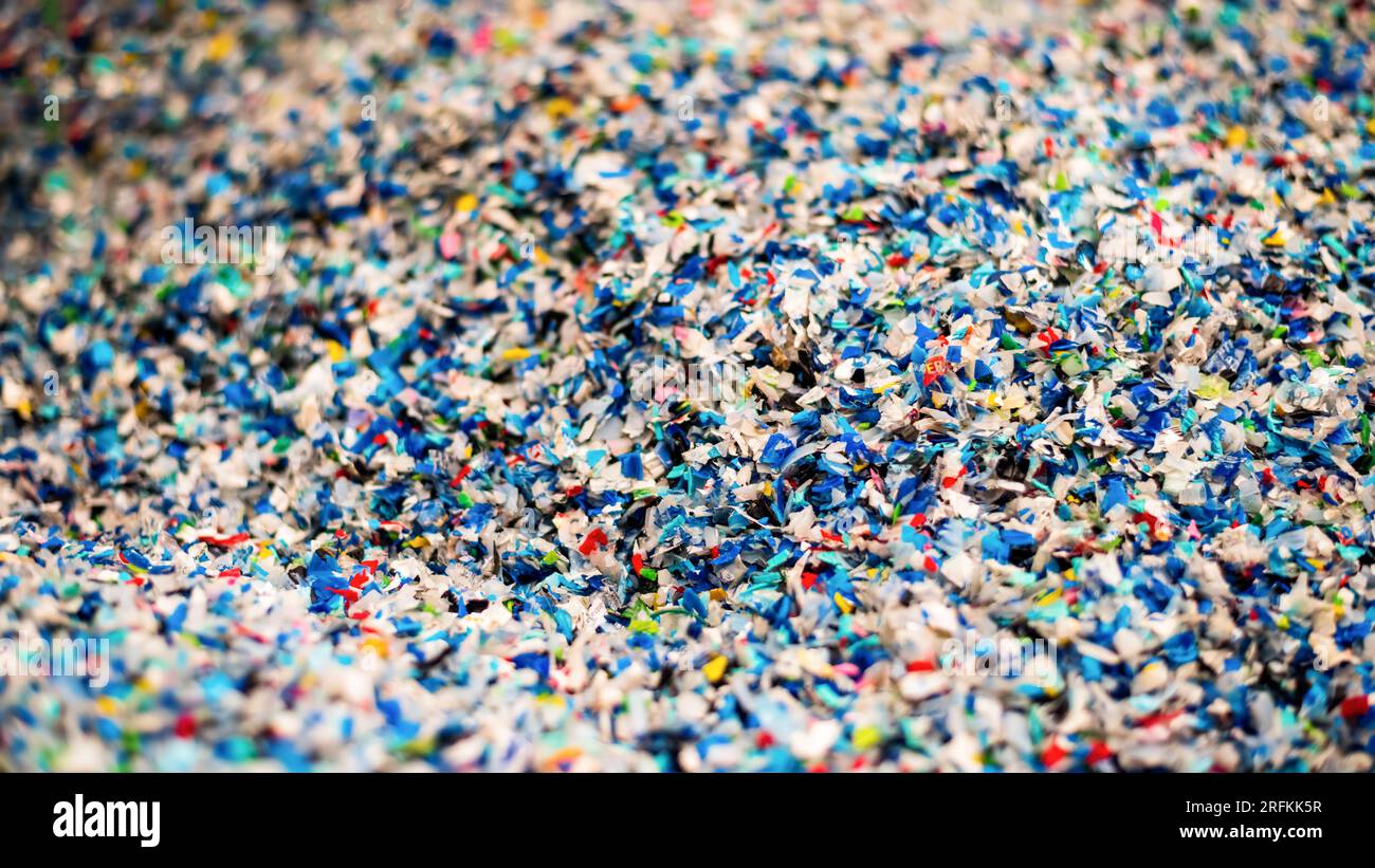 Close view of the multicoloured shredded plastic garbage at waste recycling factory Stock Photo ...
