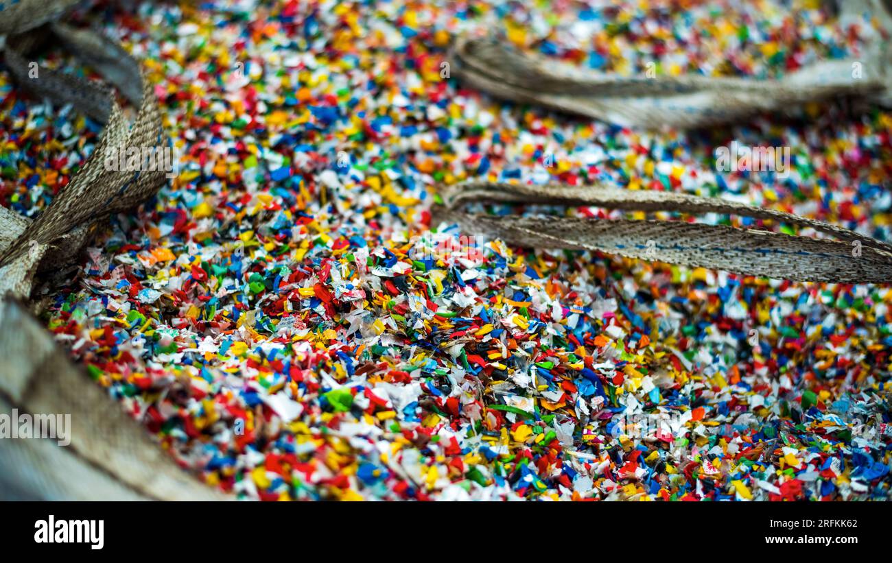 Sack of sorted multicoloured shredded plastic garbage at waste ...
