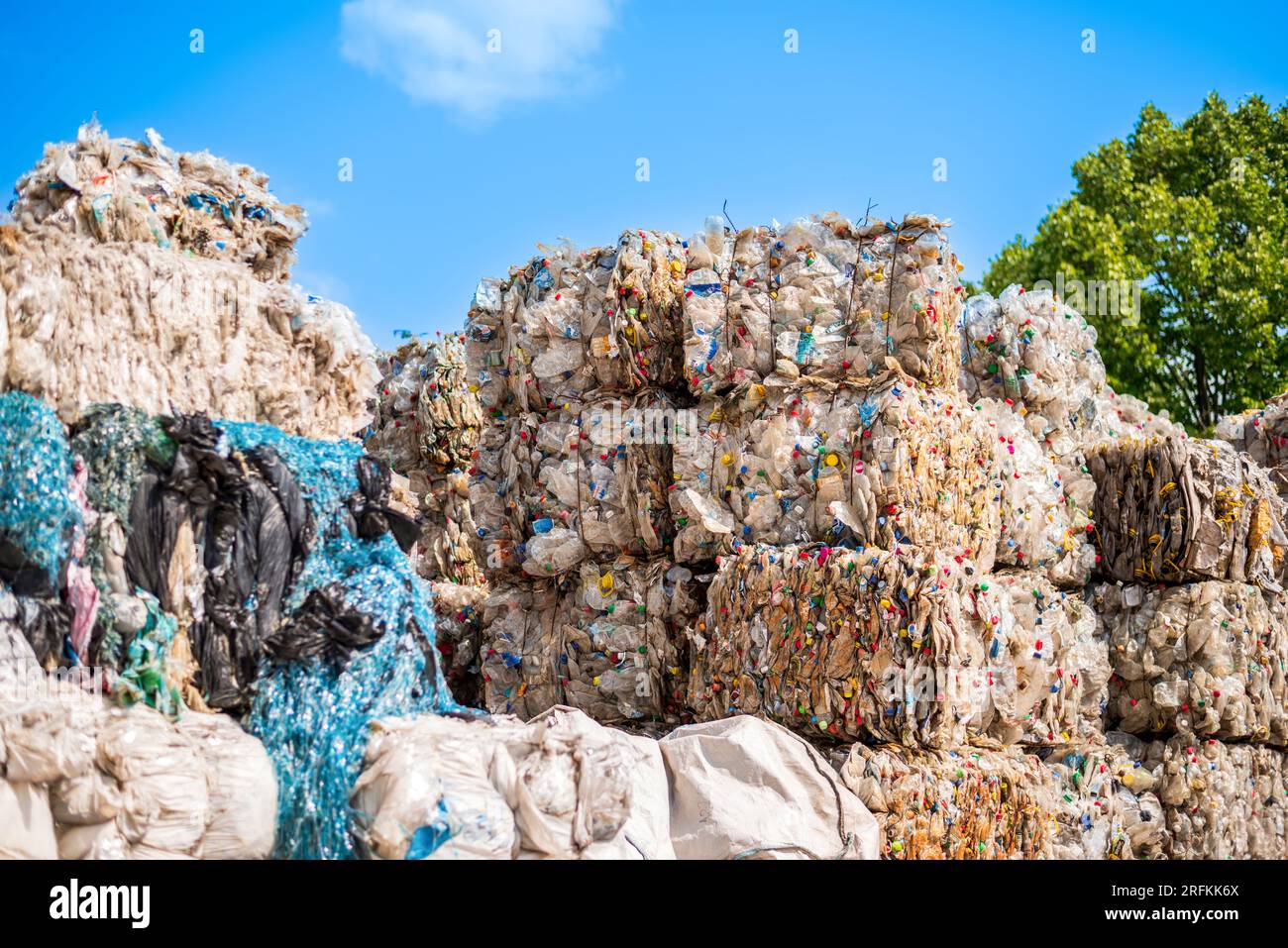 Multiple cubes of compressed plastic garbage near the waste recycling ...
