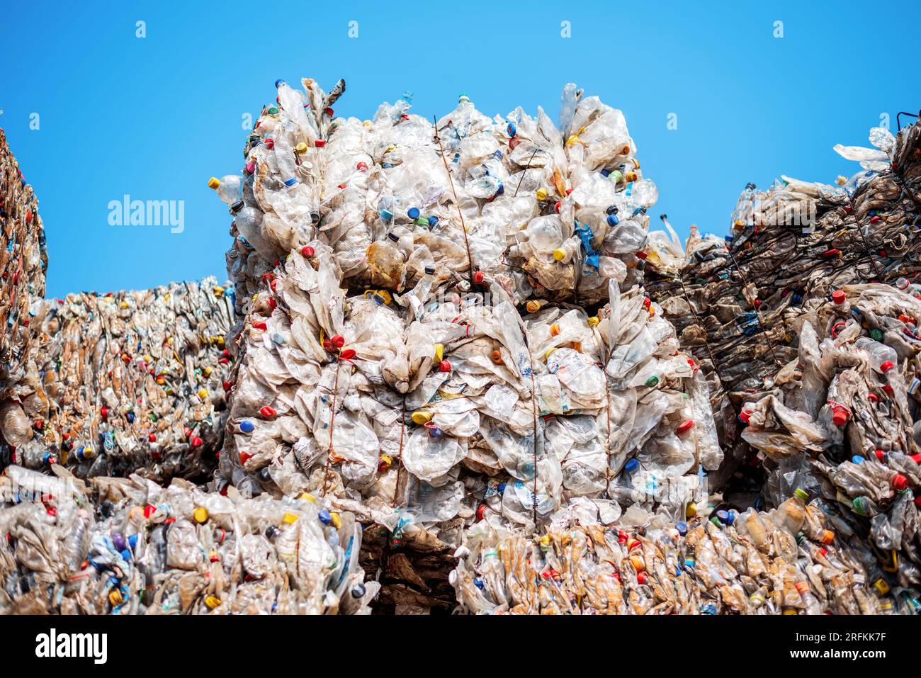 Multiple cubes of compressed plastic garbage near the waste recycling ...