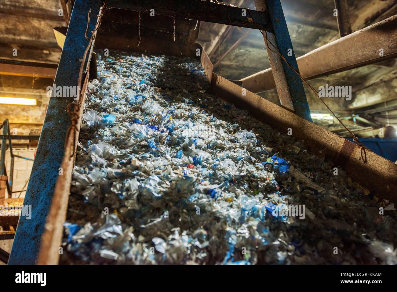 Plastic garbage on a conveyor belt at waste recycling factory Stock Photo - Alamy