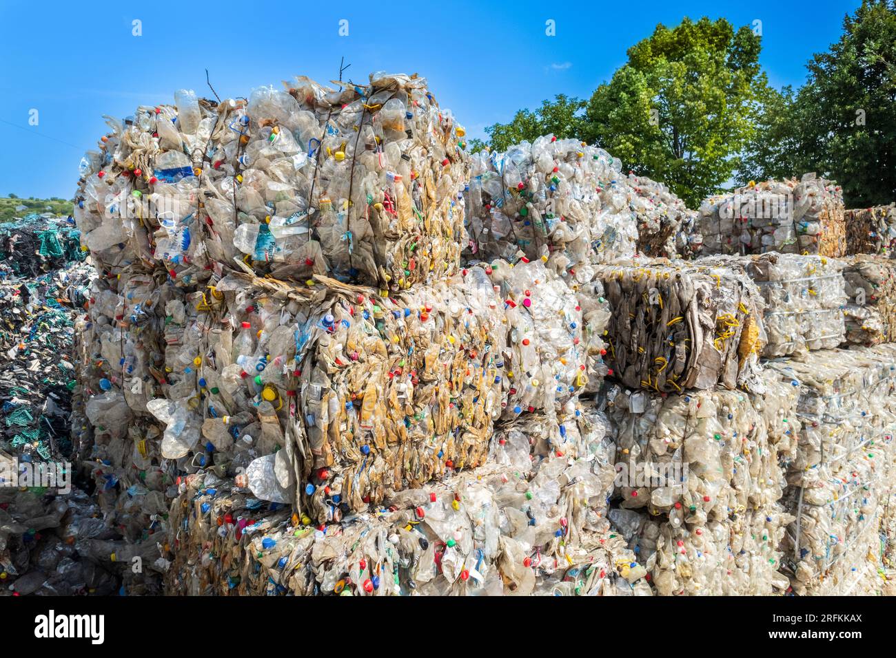 Multiple cubes of compressed plastic garbage near the waste recycling ...