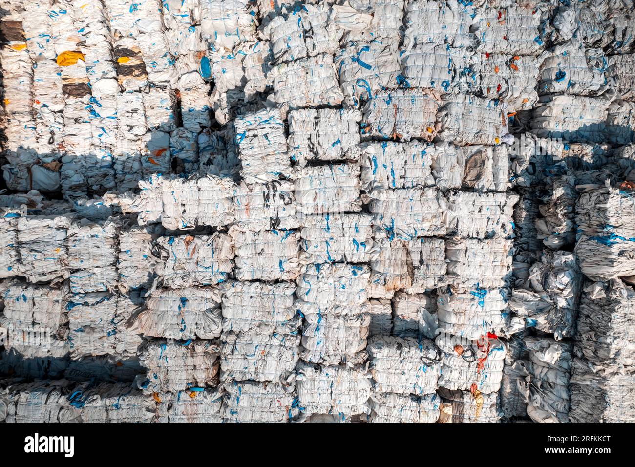 Multiple cubes of compressed plastic garbage near the waste recycling ...