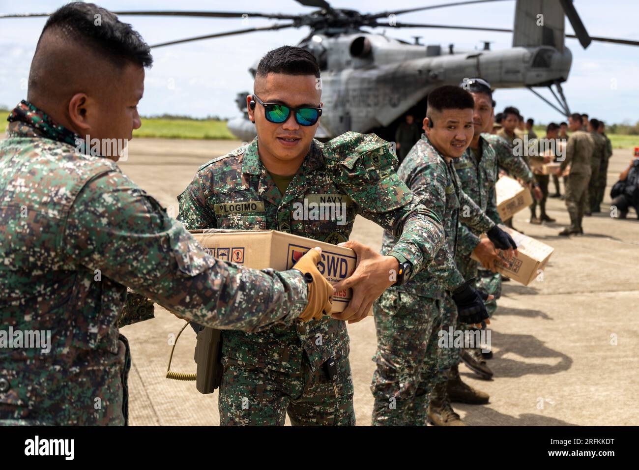Basco, Philippines. 03rd Aug, 2023. Filipino Marines help unload ...