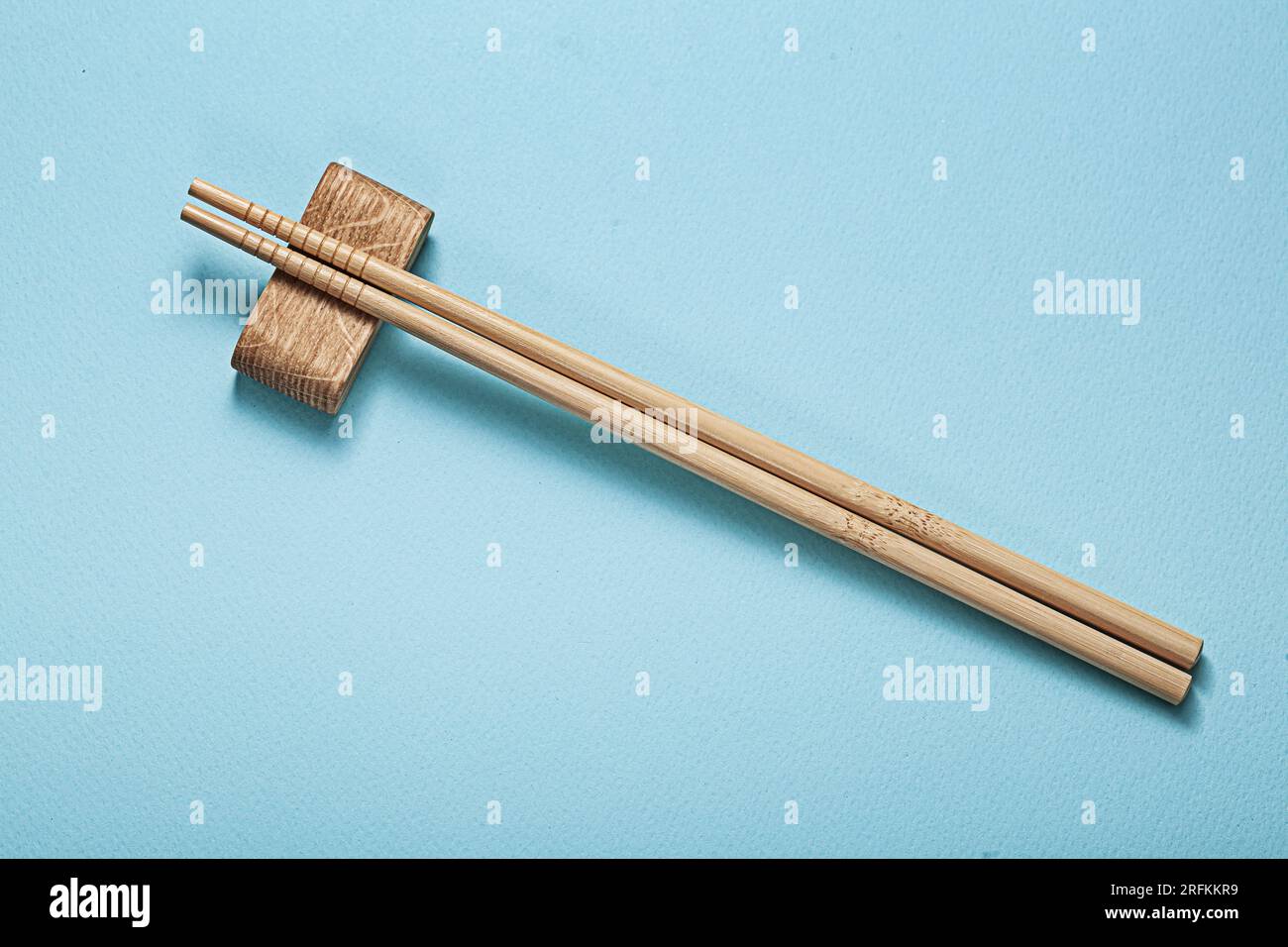 Classic Wooden Choppingsticks On Rest Stock Photo - Alamy