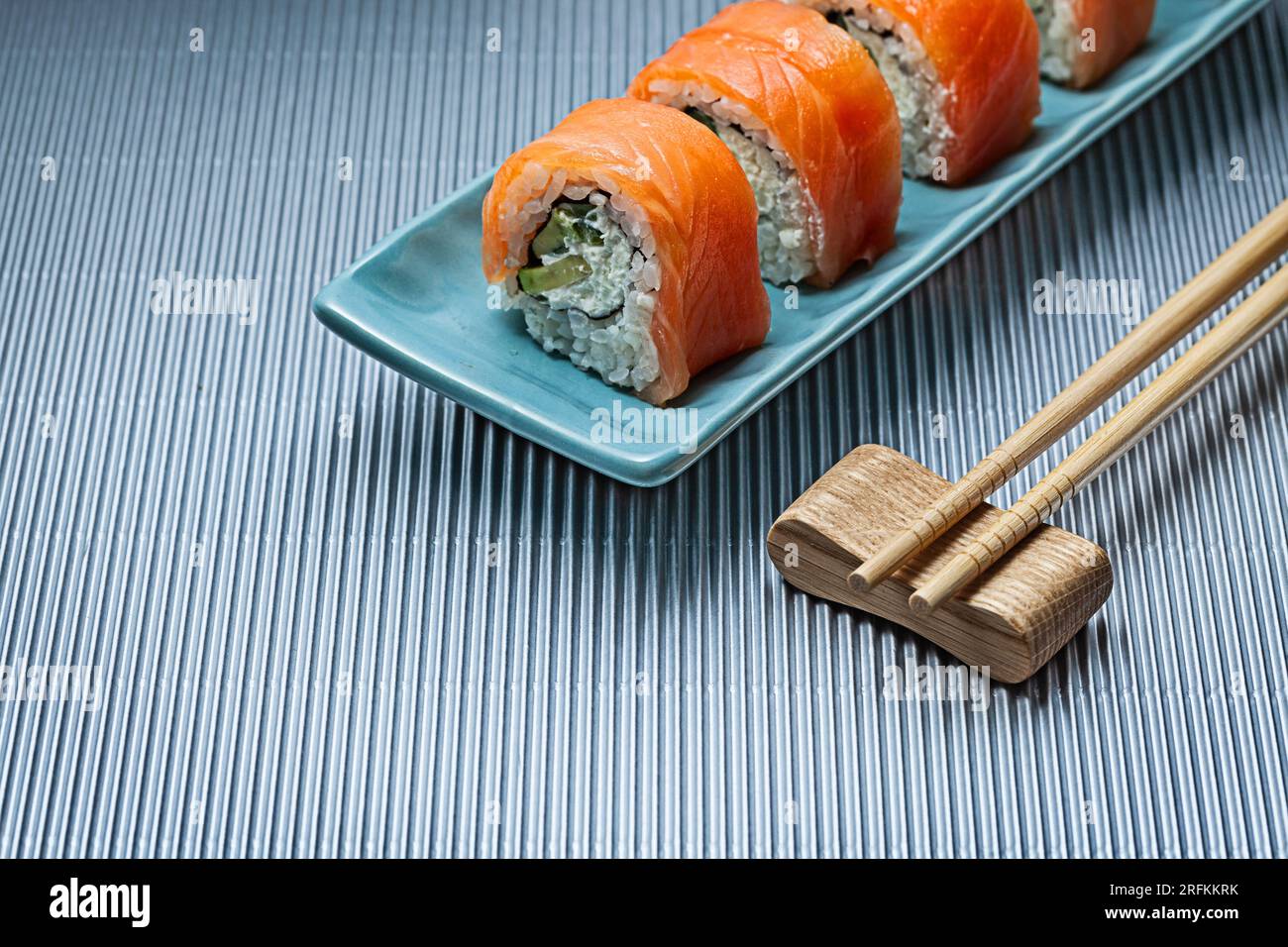 Philadelphia Rolls Of Shushi And Choppingsticks Stock Photo - Alamy