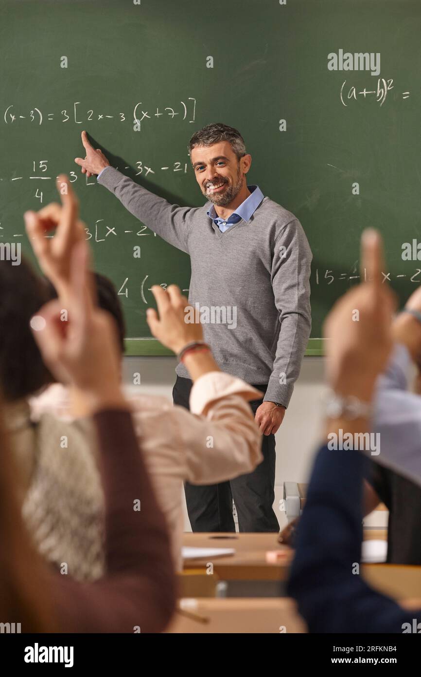 Math teacher giving lessons. Classroom with students. School education ...