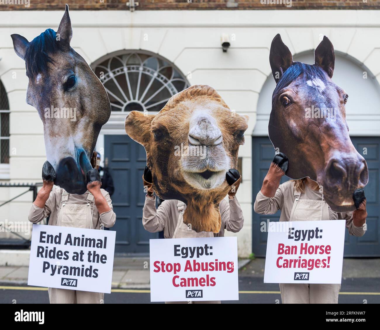 London, UK. 4 August 2023. PETA supporters wearing “hooves” and giant ...