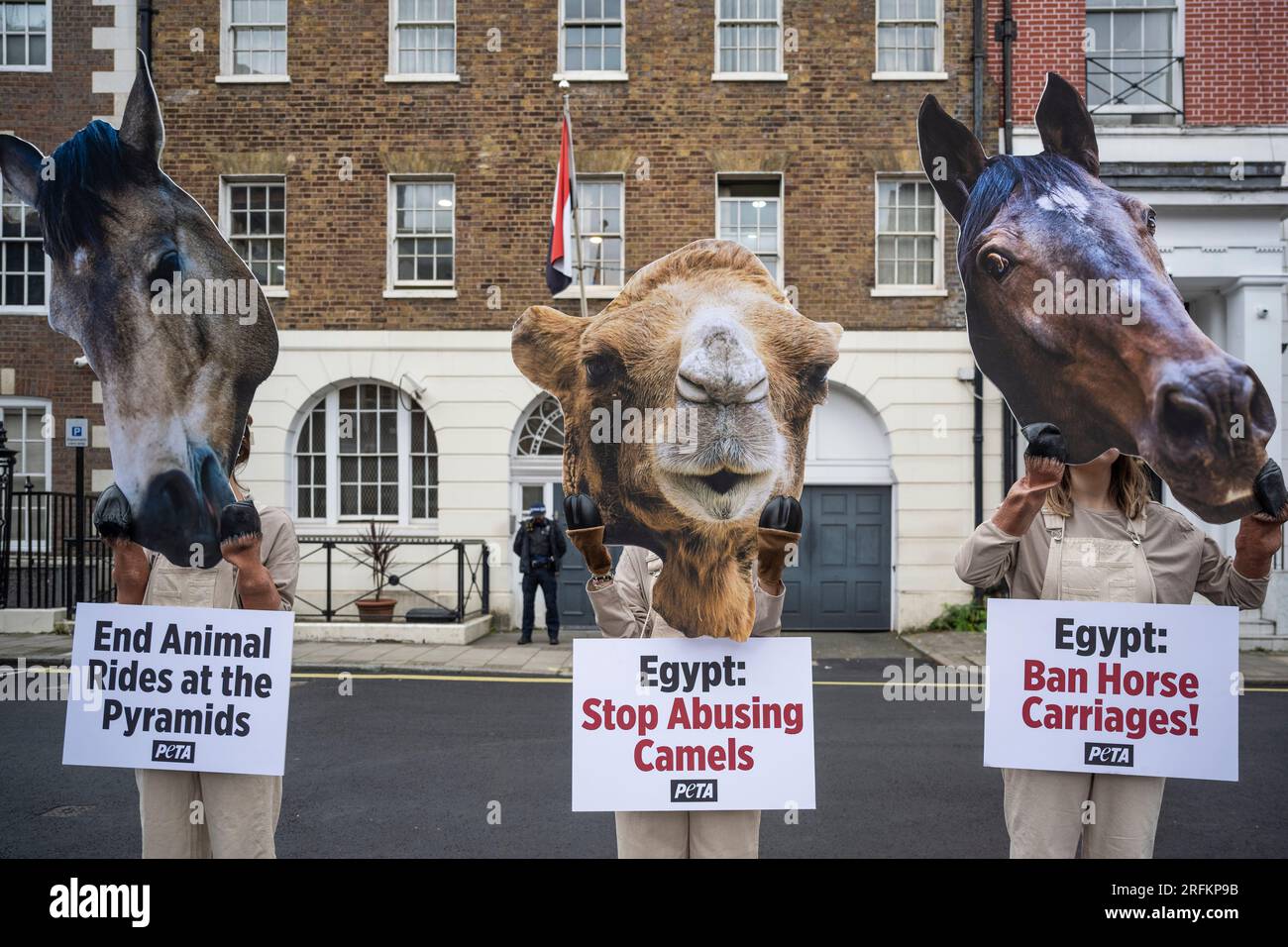 London, UK. 4 August 2023. PETA supporters wearing “hooves” and giant ...