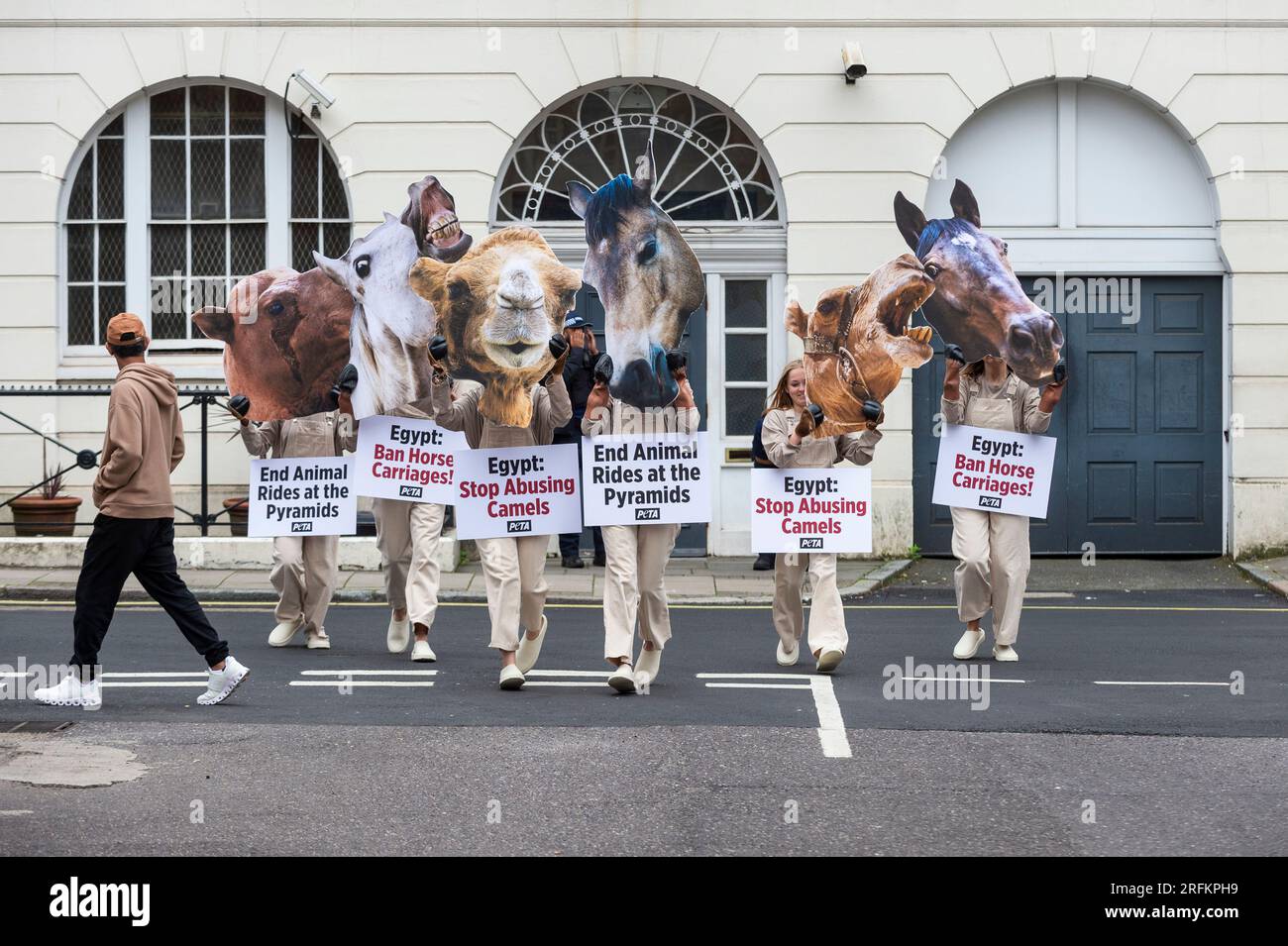 London, UK. 4 August 2023. PETA supporters wearing “hooves” and giant ...