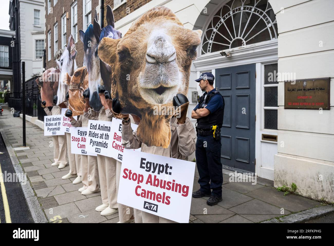 London, UK. 4 August 2023. PETA supporters wearing “hooves” and giant ...