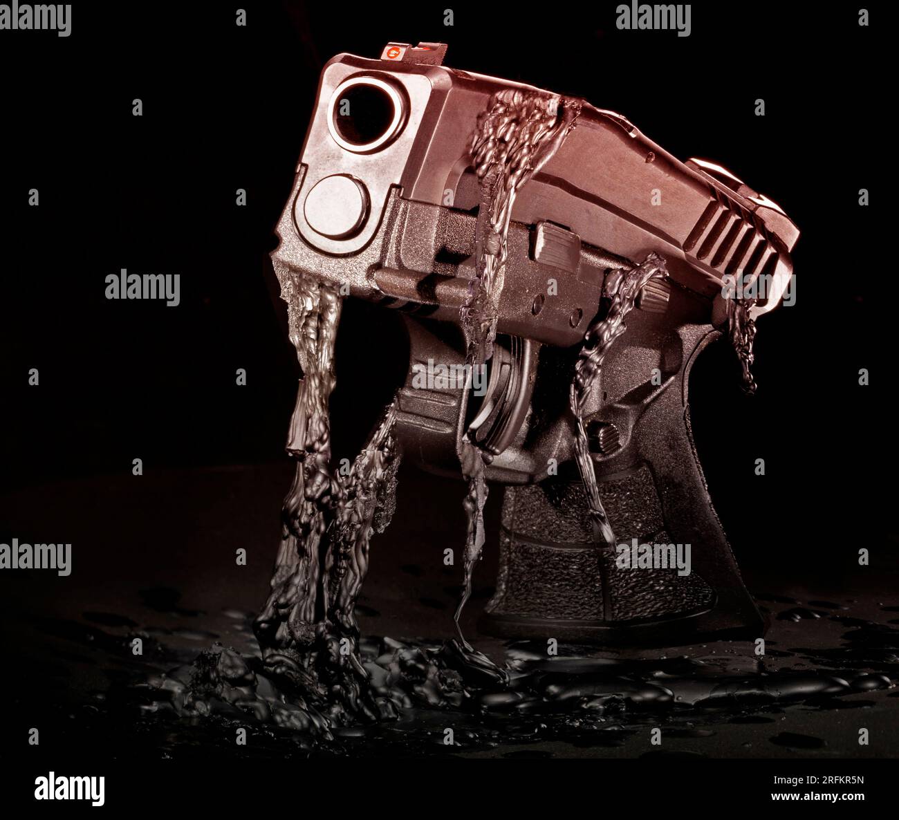 Red hot ghost gun coming out of the polymer ozze of a 3-D printer Stock ...