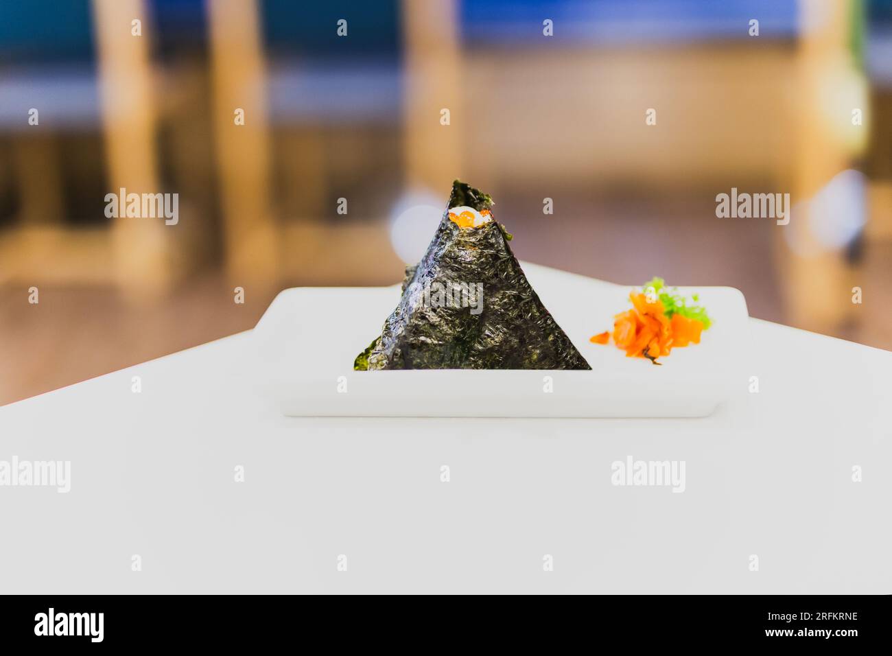 Japanese Onigiri traditional food in triangle shape wrap with seaweed ...