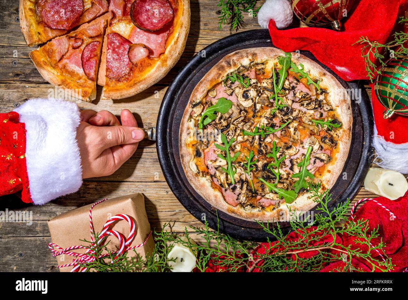 Christmas decorated background with pepperoni and mushrooms pizza,with ...