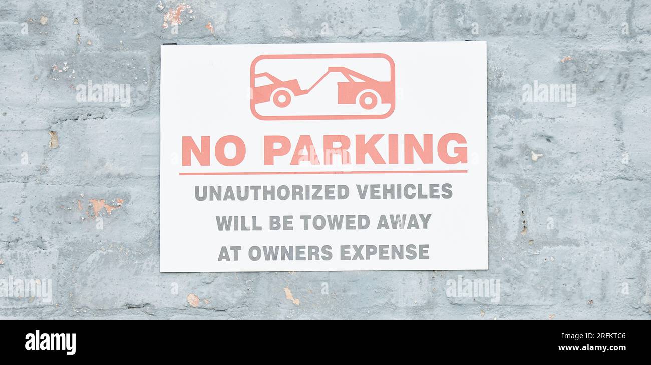 Warning, parking and stop with sign and towing icon on wall for ...