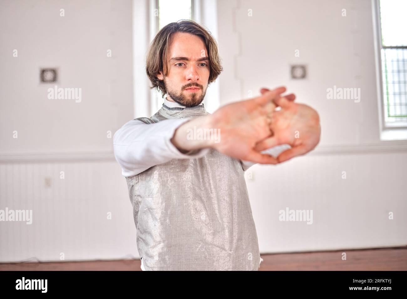 Exercise, fencing and man stretching, fitness and training with ...