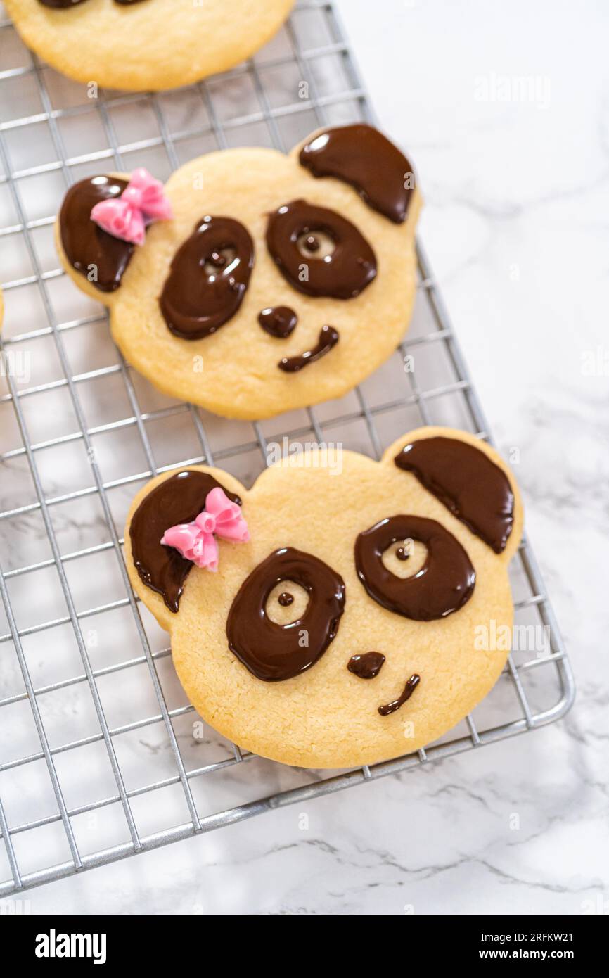 Panda shaped shortbread cookies with chocolate icing Stock Photo - Alamy