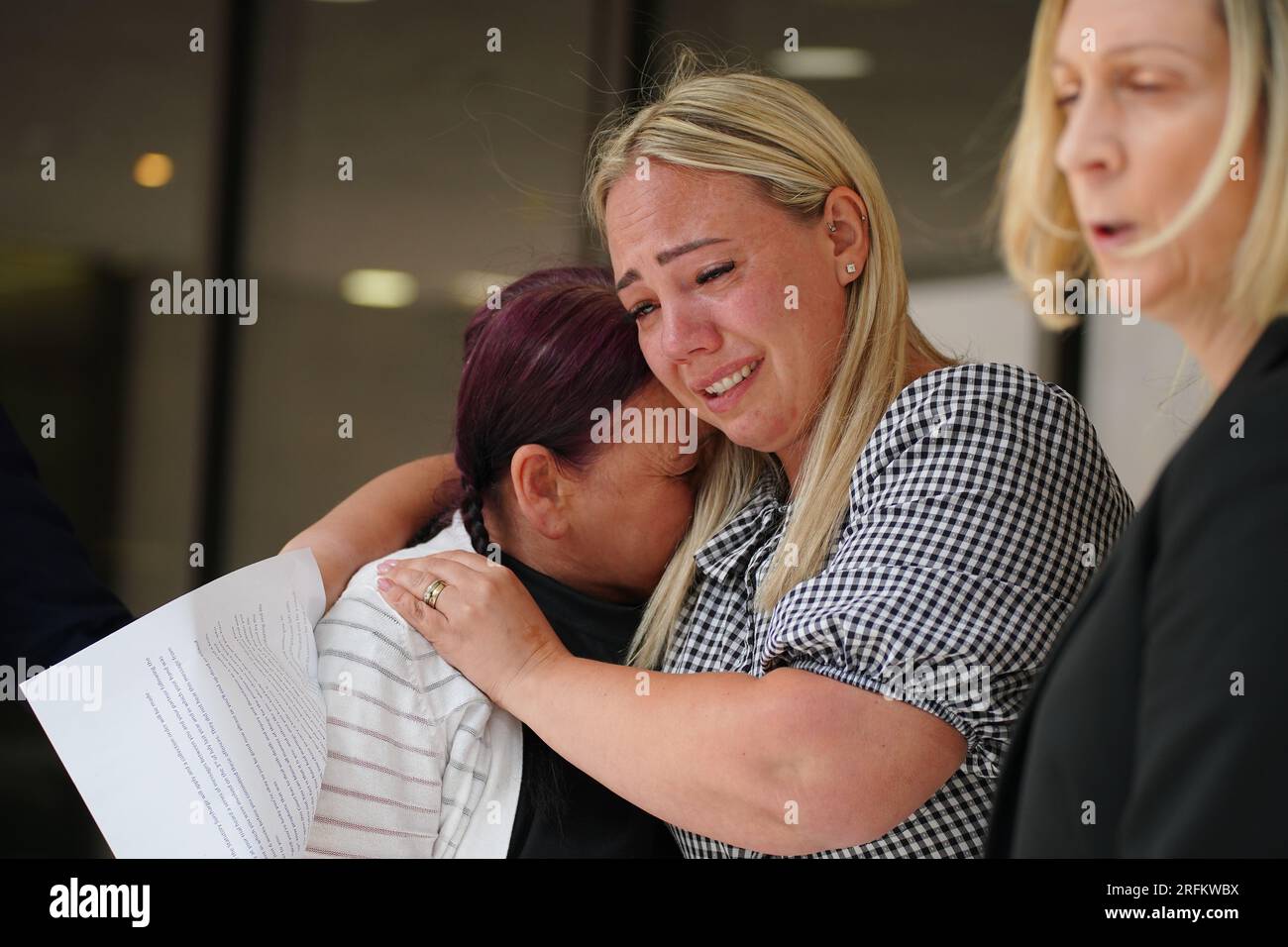 Sarah Reilly (centre), mother of Harvey Reilly, outside Manchester ...