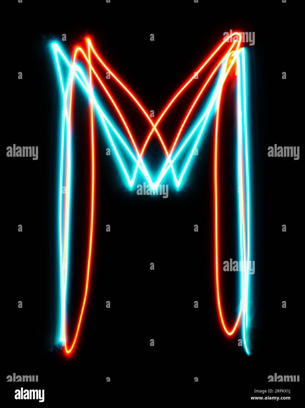Letter M of the alphabet made from neon sign. The blue red light image ...