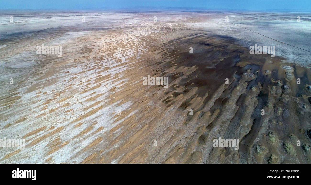 GOLMUD, CHINA - JULY 21, 2023 - The salt crust of the Qaidam Basin is ...