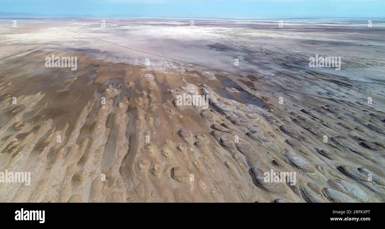 GOLMUD, CHINA - JULY 21, 2023 - The salt crust of the Qaidam Basin is ...