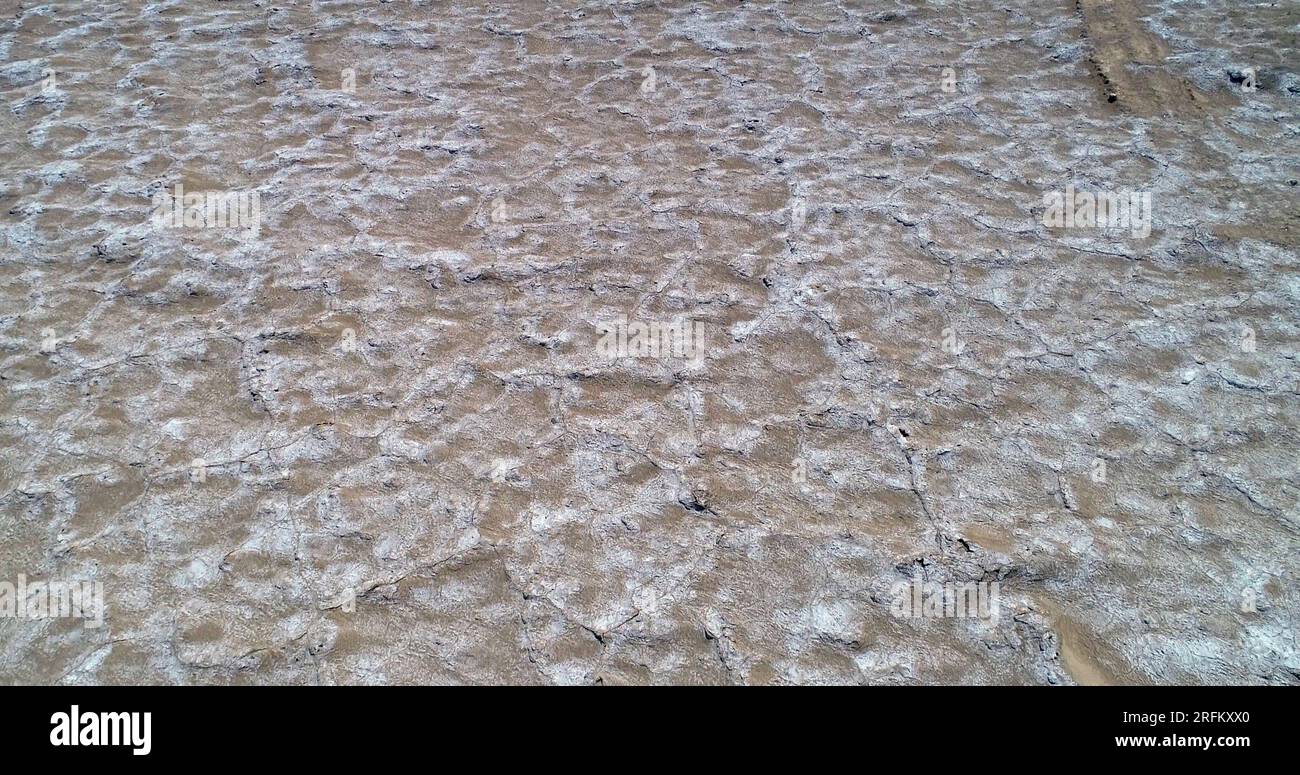 GOLMUD, CHINA - JULY 21, 2023 - The salt crust of the Qaidam Basin is ...