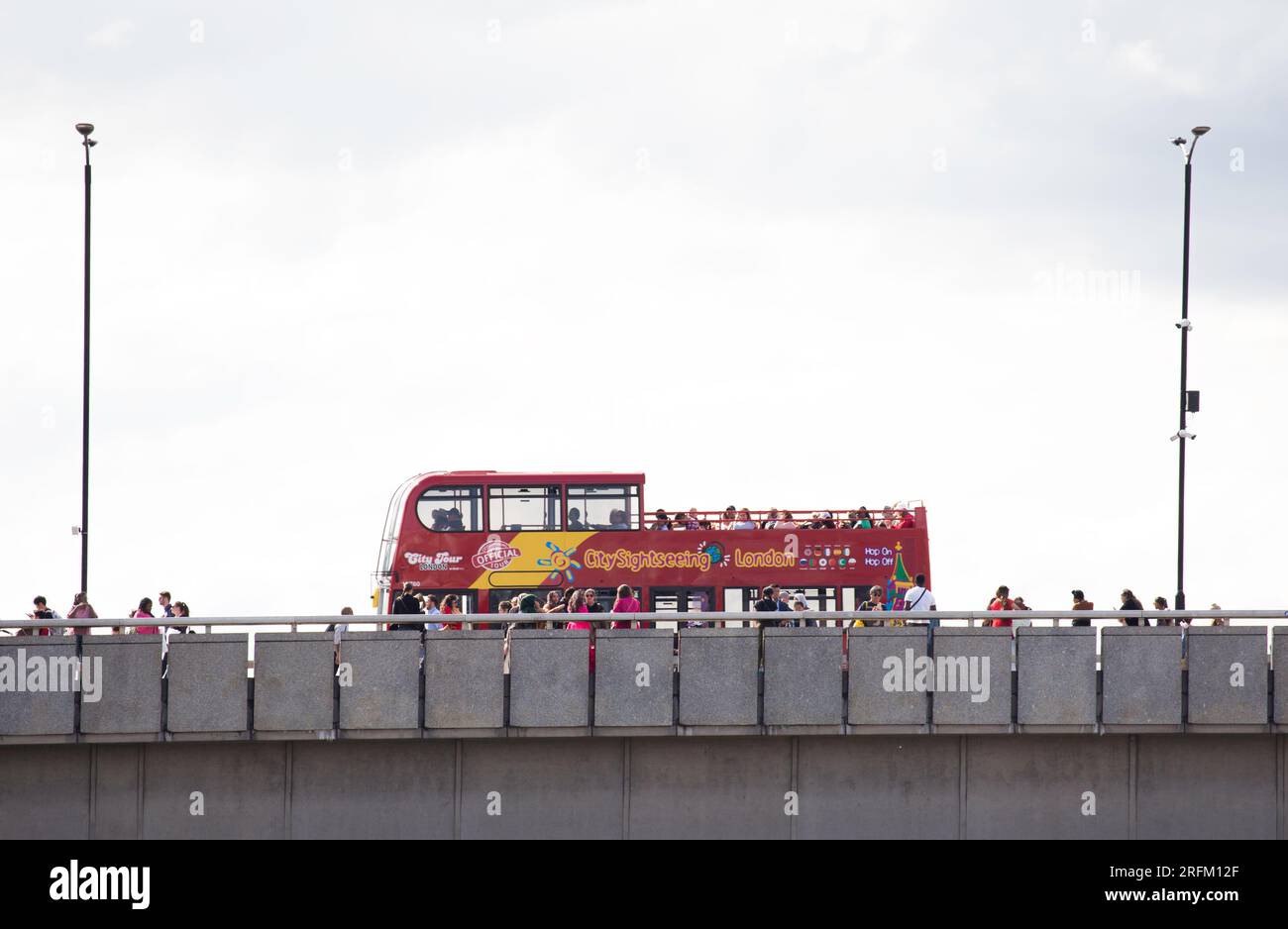 Red London Bus on the river Thames with commuters Stock Photo - Alamy