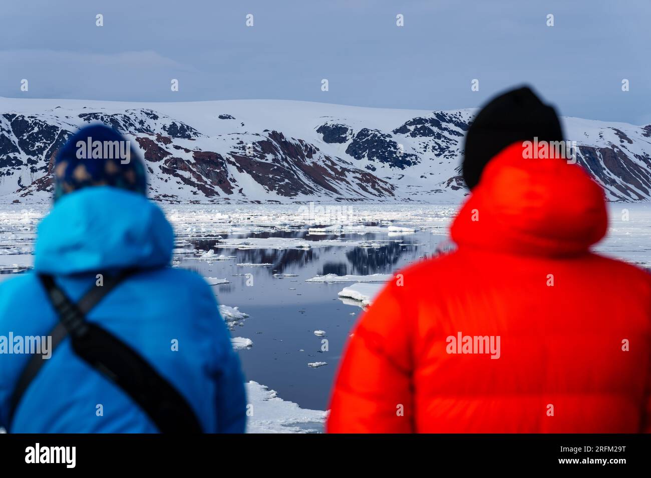 People watching the arctic landscape of Svalbard from a ship Stock ...