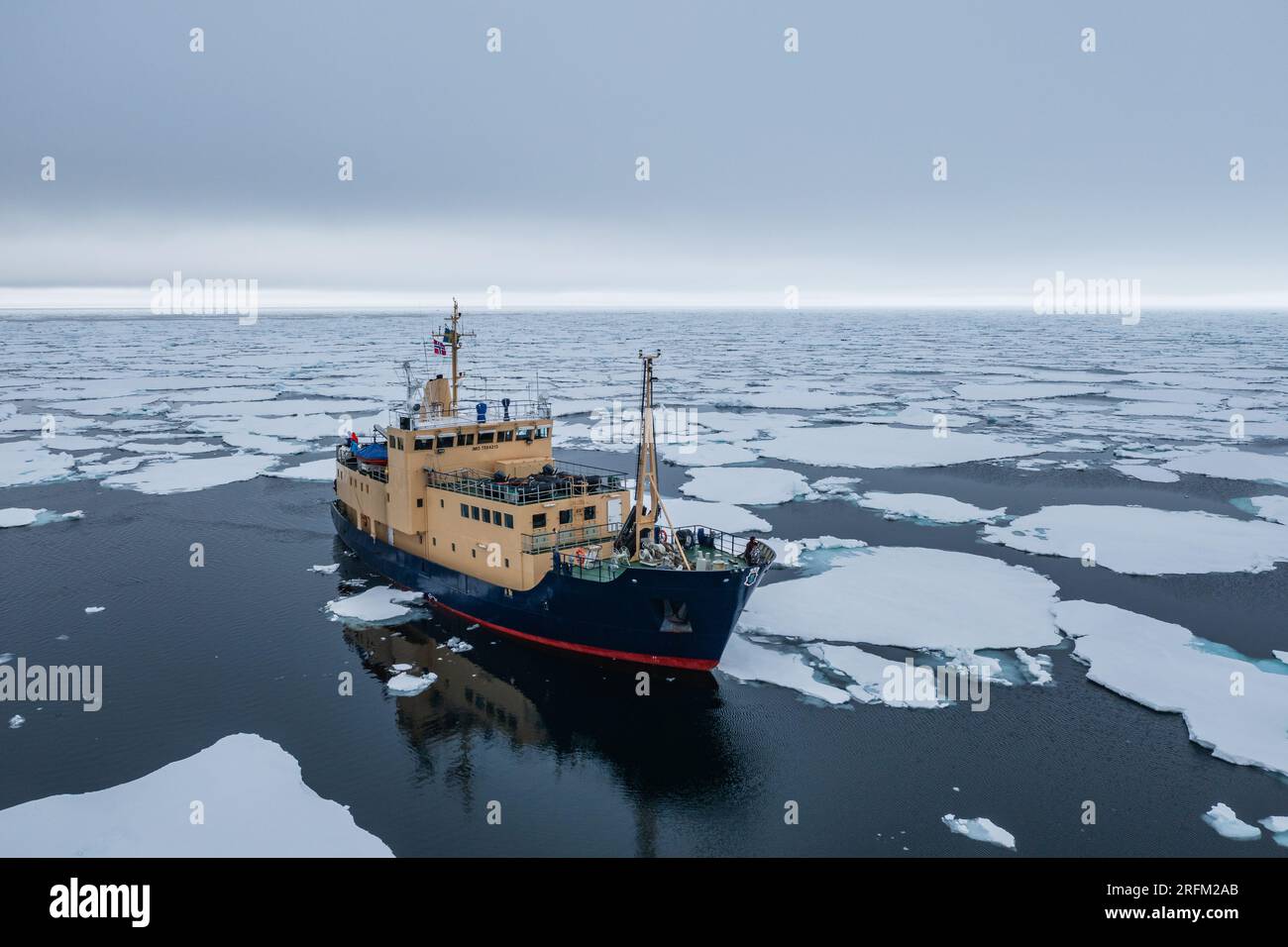 Ship cruising through the ice in Svalbard Stock Photo - Alamy