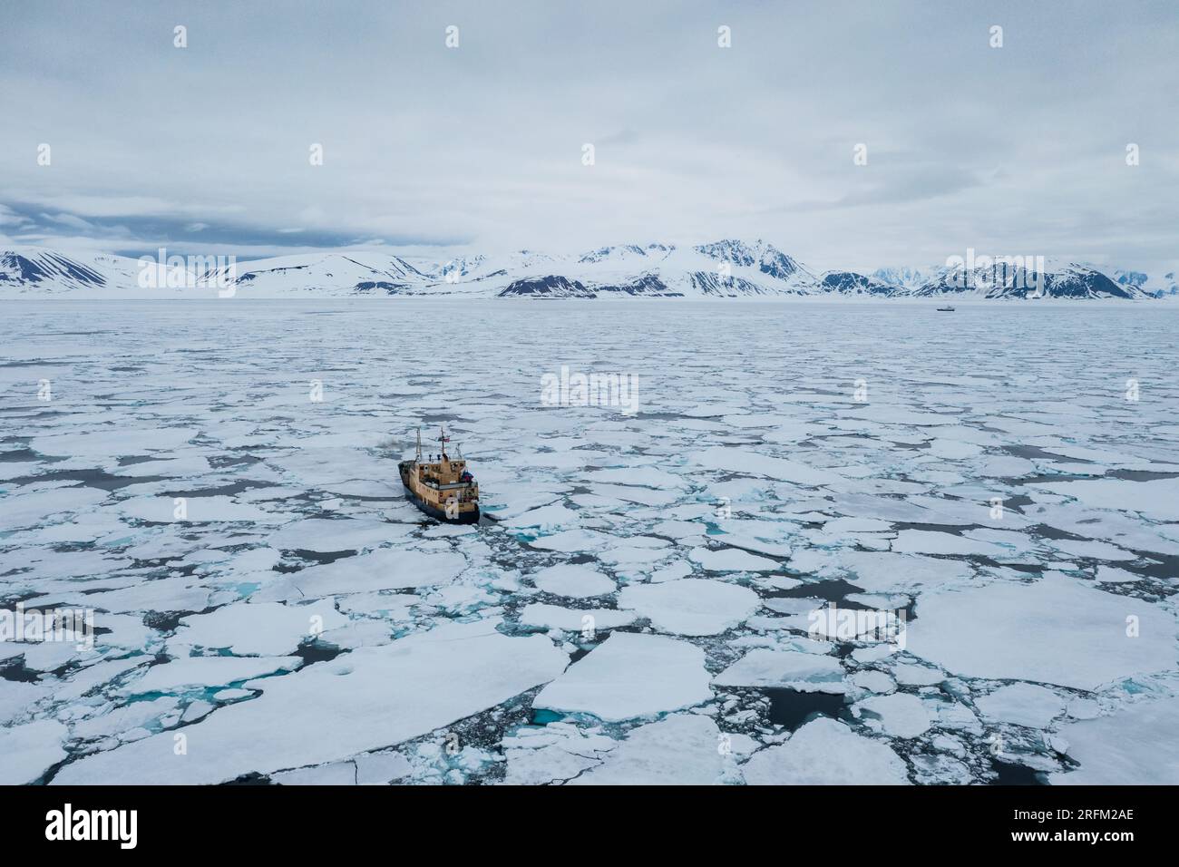 Ship cruising through the ice in Svalbard Stock Photo - Alamy