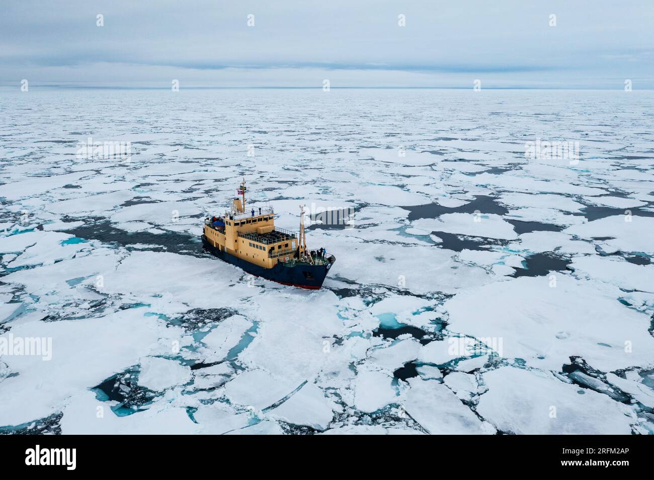 Ship cruising through the ice in Svalbard Stock Photo - Alamy