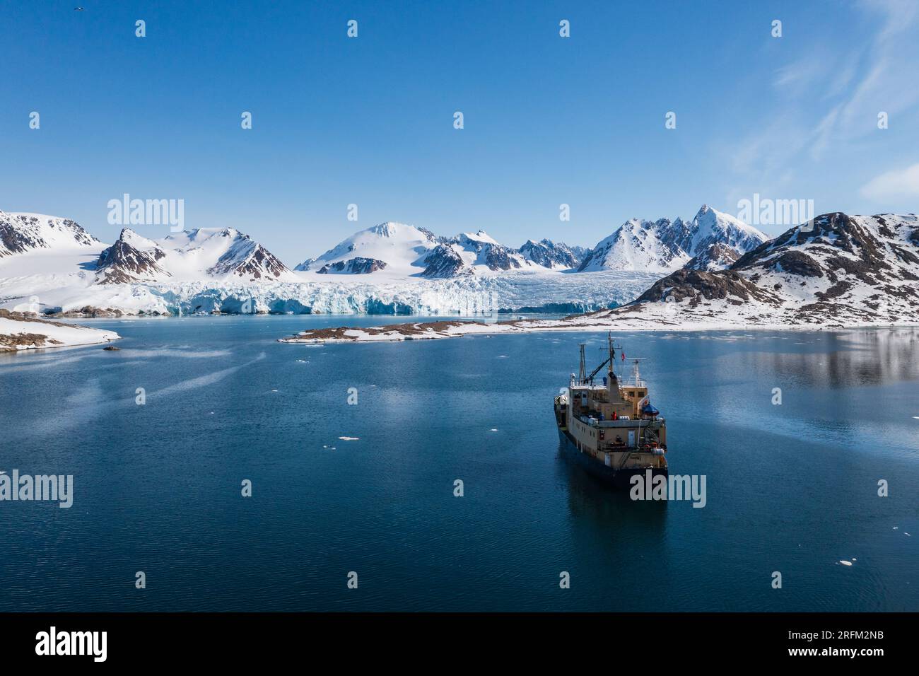 Ship cruising through the ice in Svalbard Stock Photo - Alamy