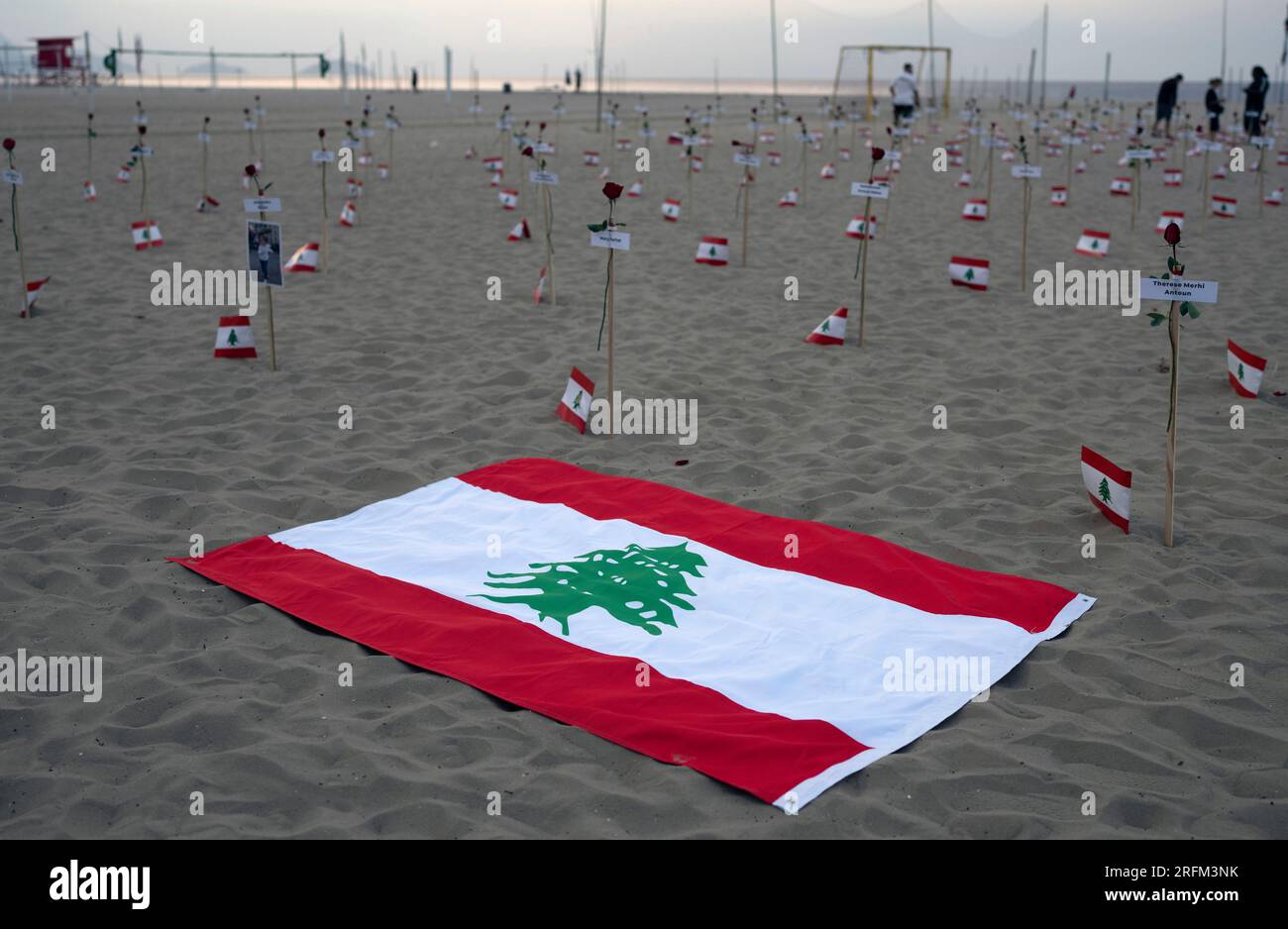 A Lebanese flag lays on Copacabana beach in honor of those who died in ...