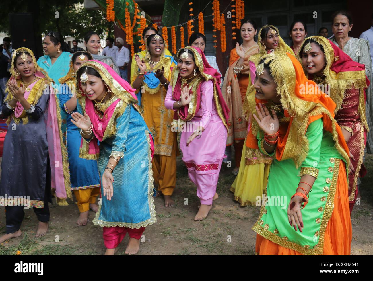 Amritsar. 4th Aug, 2023. Women in traditional Punjabi attire celebrate ...