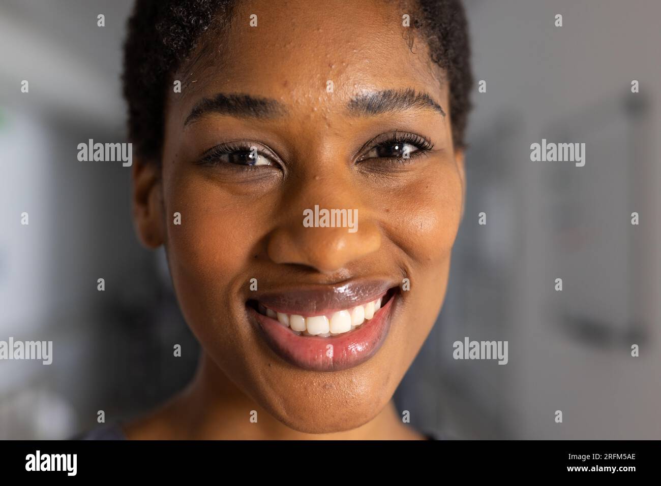Portrait of happy african american female doctor with short hair in ...