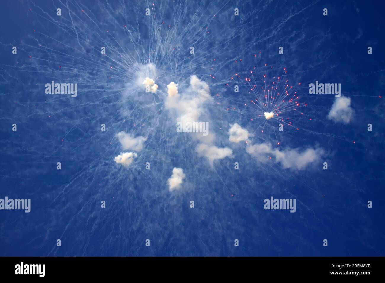 flash and white smoke in the blue sky Stock Photo - Alamy