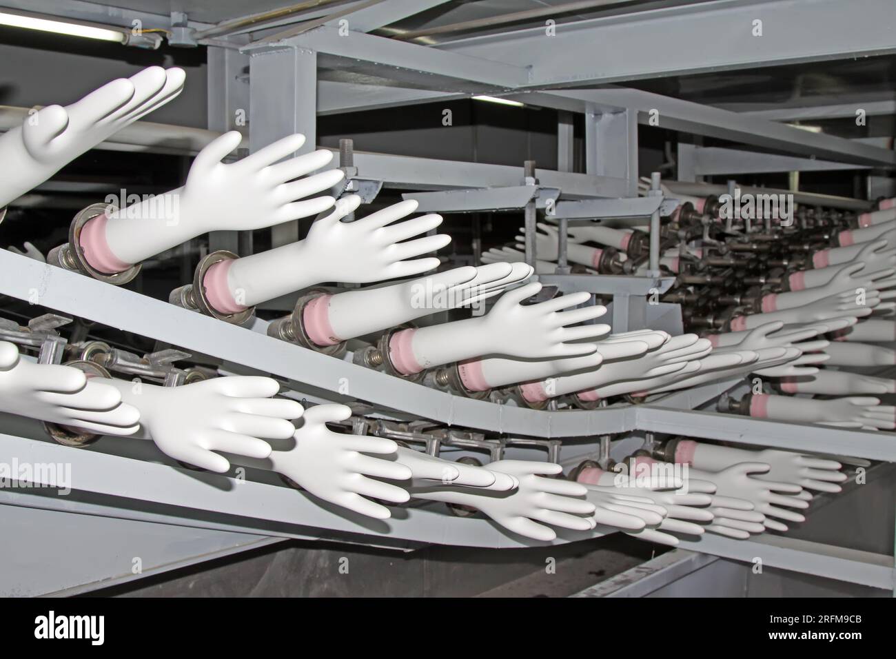 closeup of acrylonitrile butadiene gloves production line Stock Photo ...
