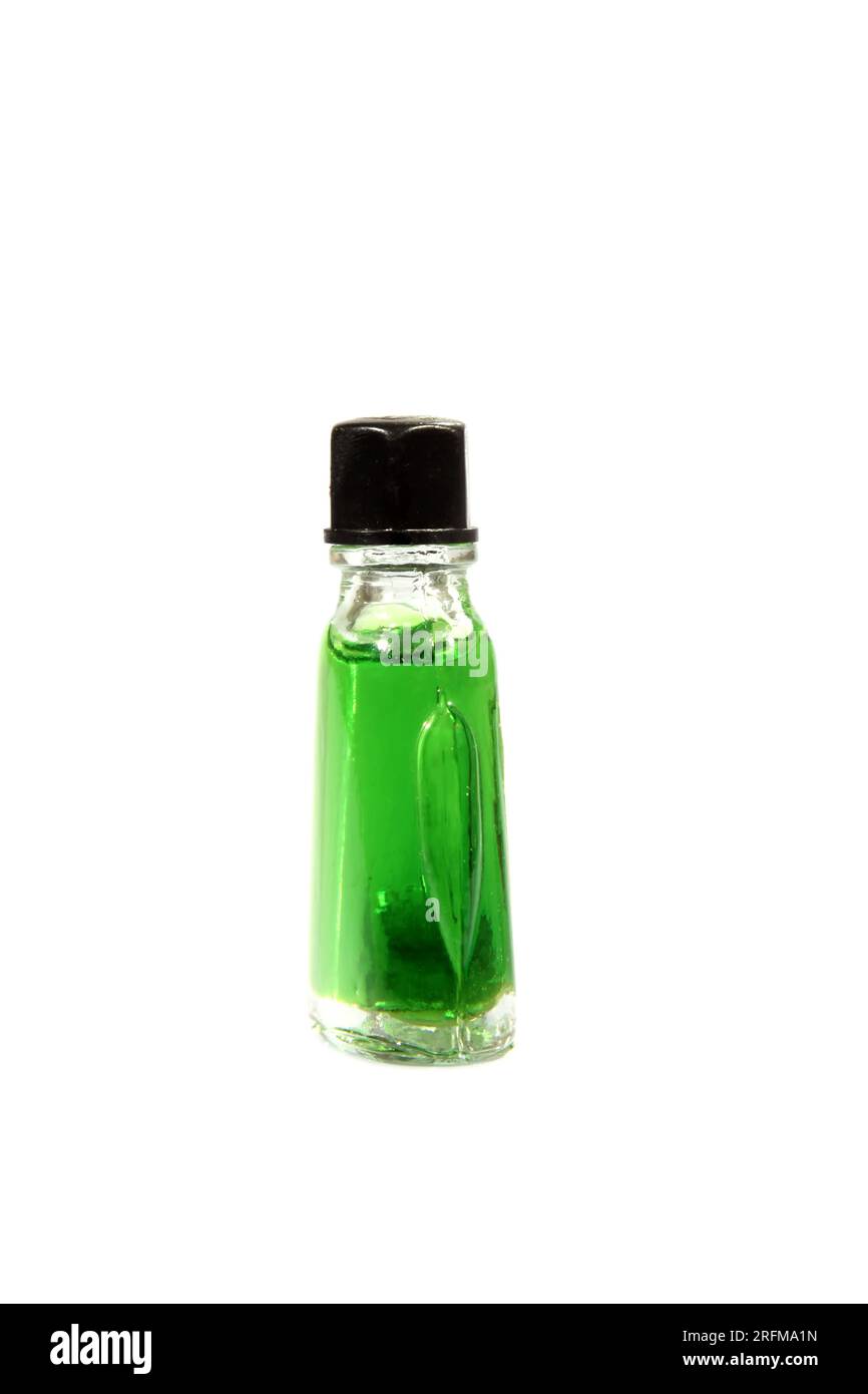 green liquid in glass bottles on a white background Stock Photo - Alamy