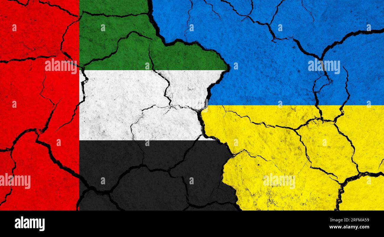 Flags of United Arab Emirates and Ukraine on cracked surface - politics ...