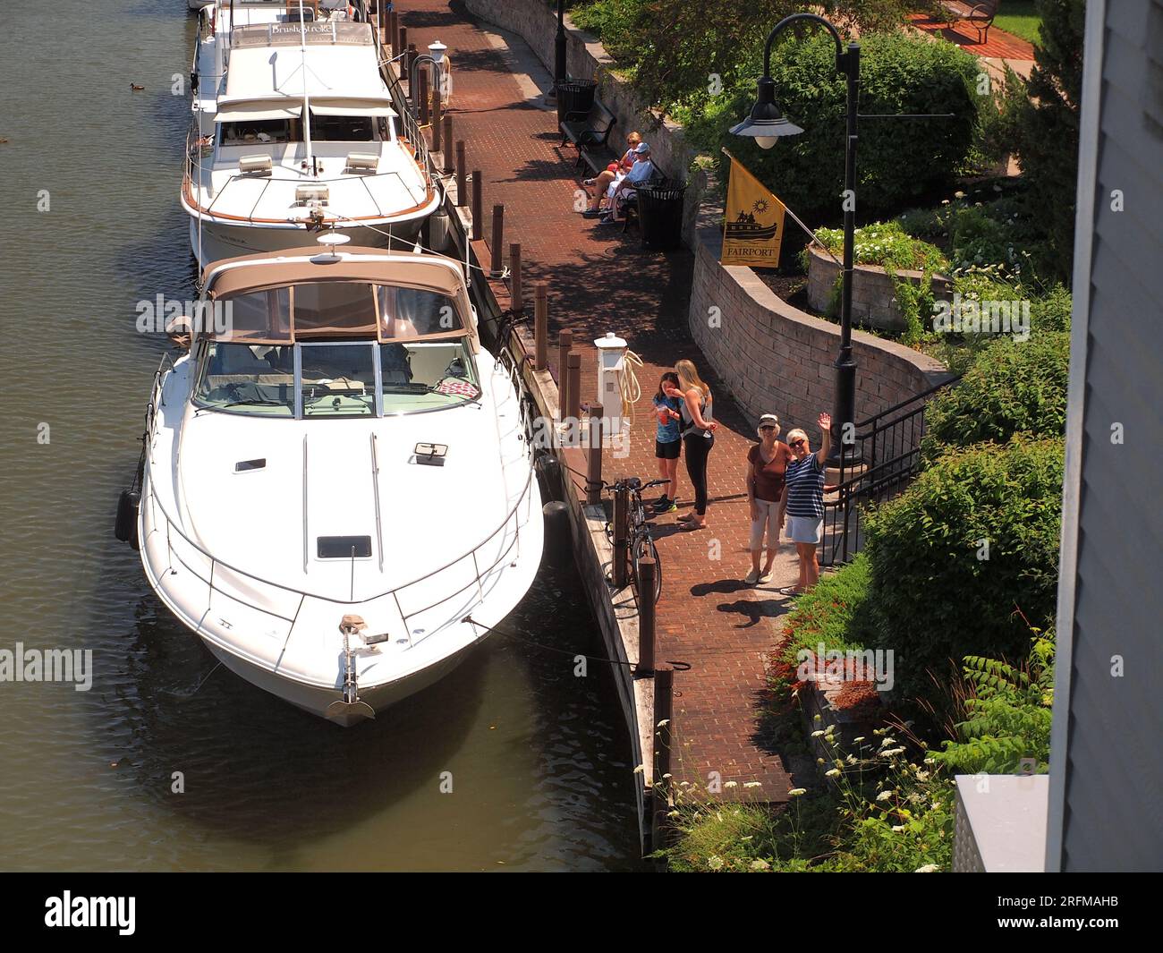 Scenes along the Erie Canal in Fairport, New York with canal boats and ...