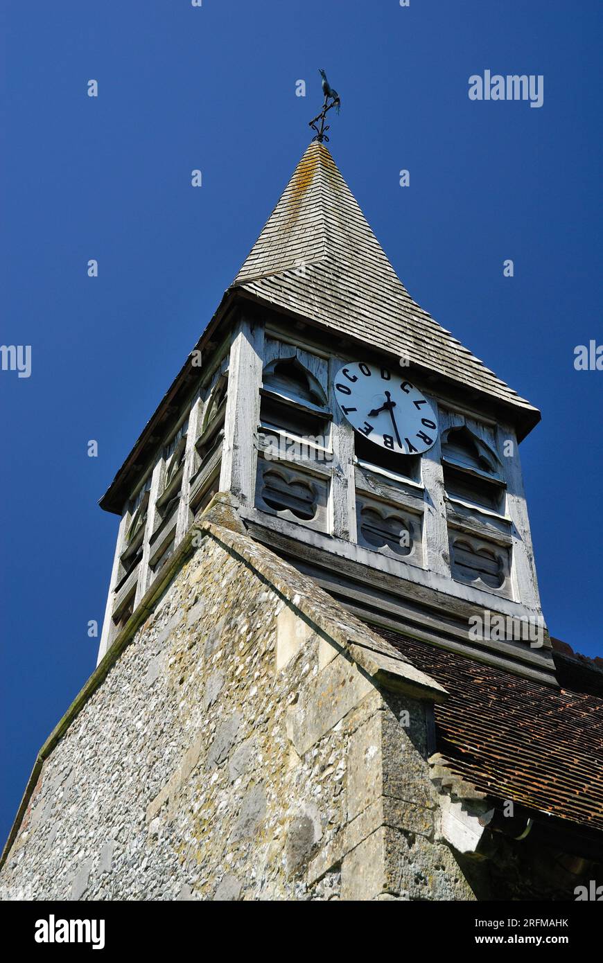 Unusual clock face on the spire of St Andrew's church, Wootton Rivers ...