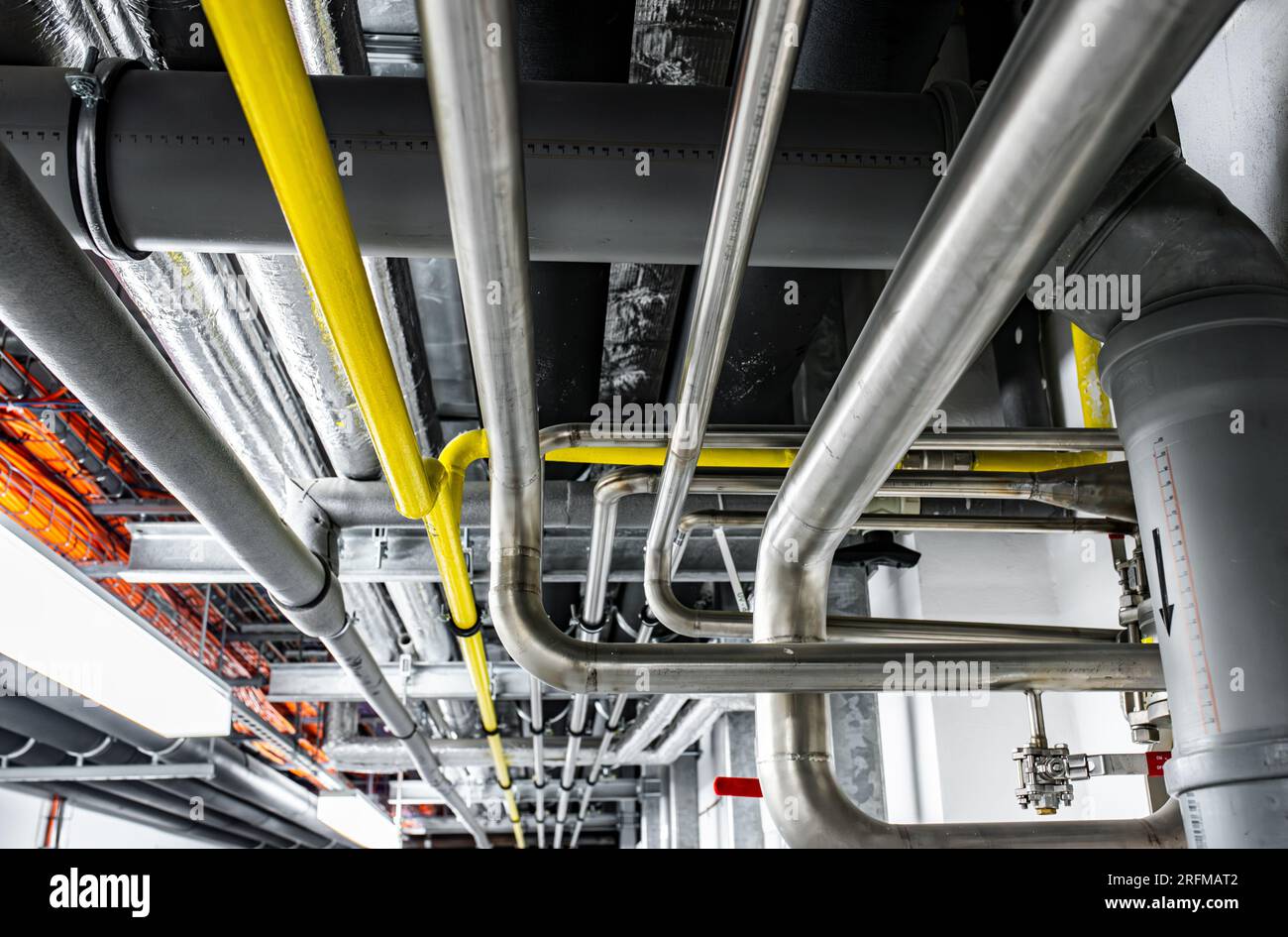 Gas and waste pipelines in the underground premises of the factory ...