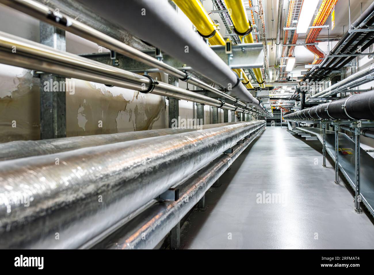 Gas and waste pipelines in the underground premises of the factory ...