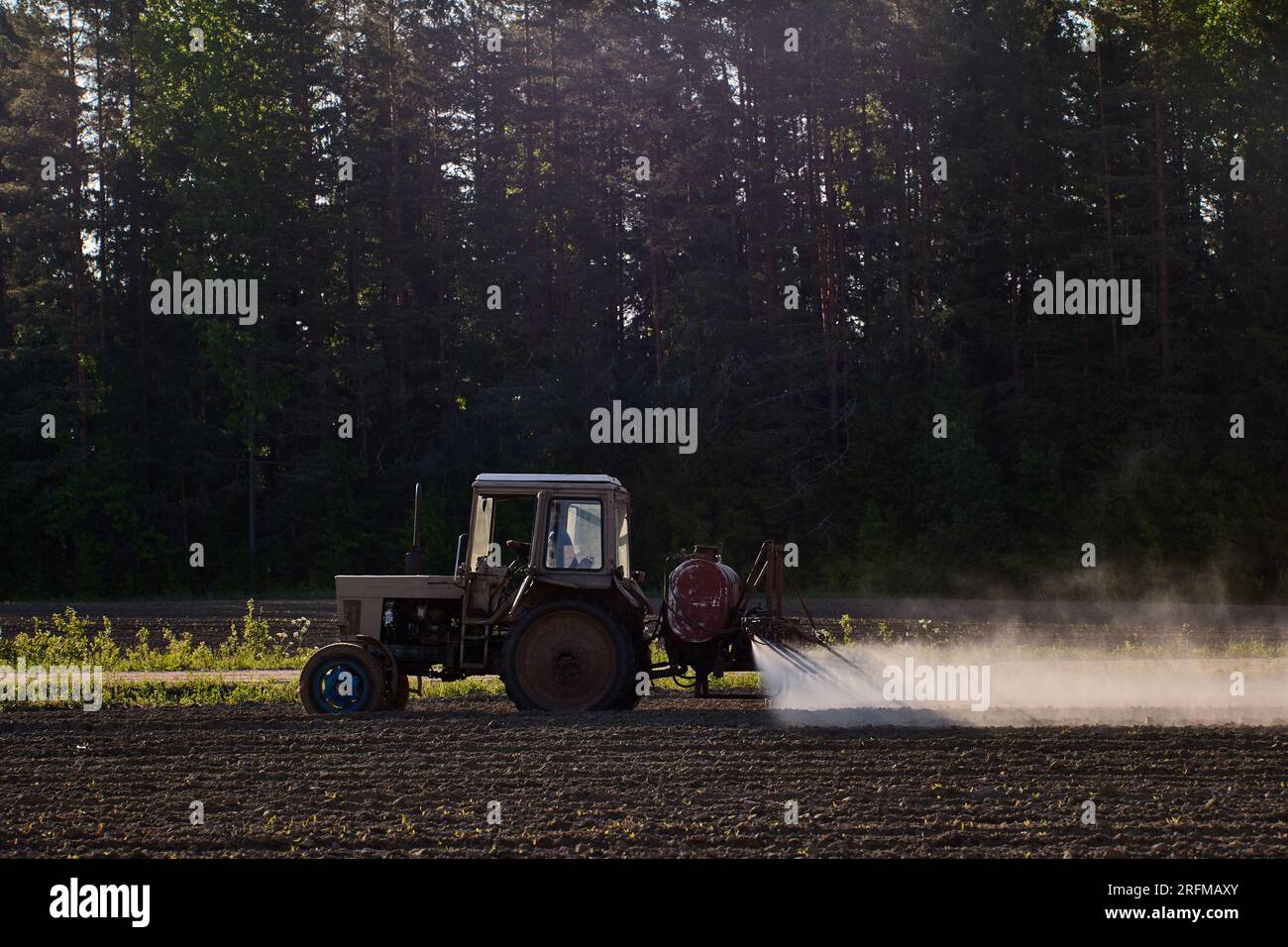 Tractor working in vegetable field in springtime hi-res stock ...