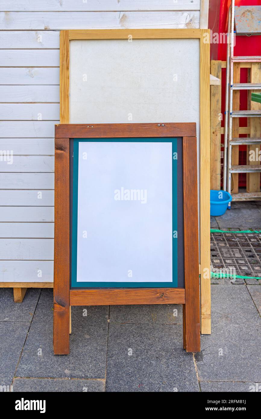 Wood Advertising Poster A Frames Behind White Cabin Stock Photo - Alamy