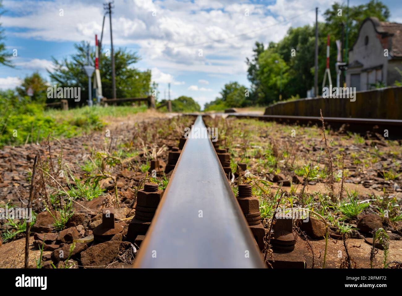 Abandoned railway station with light barrier and rails in Hungary Stock ...