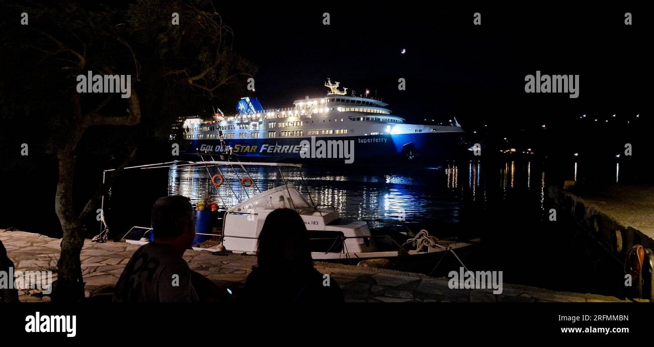 Ferry-boat landing at night in Gavrio harbor, Gavrio, Andros Island ...