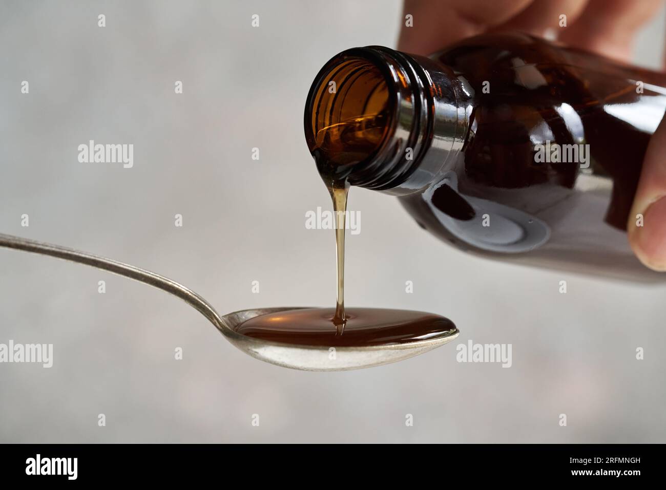 Hand pouring syrup hi-res stock photography and images - Alamy